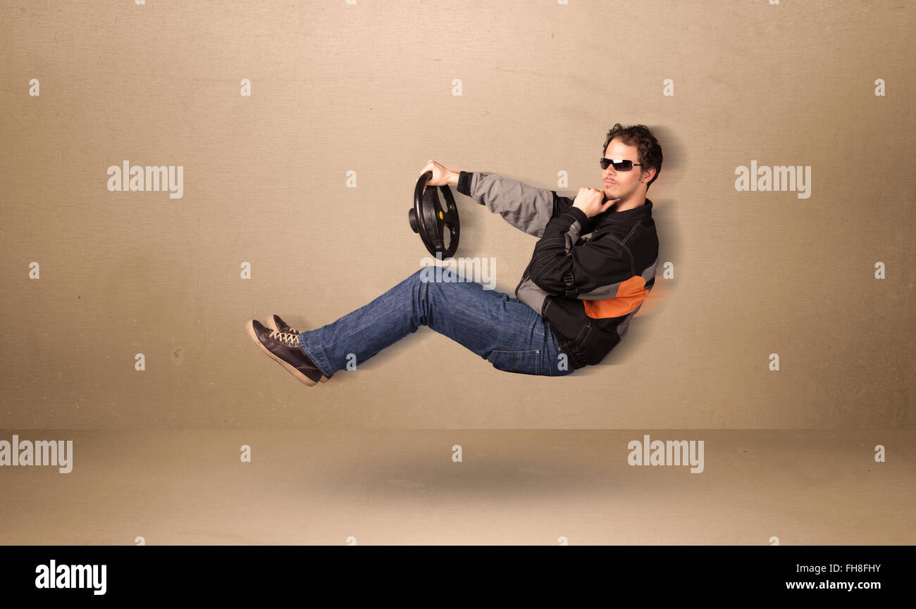 Happy funny man driving a flying car concept Stock Photo - Alamy