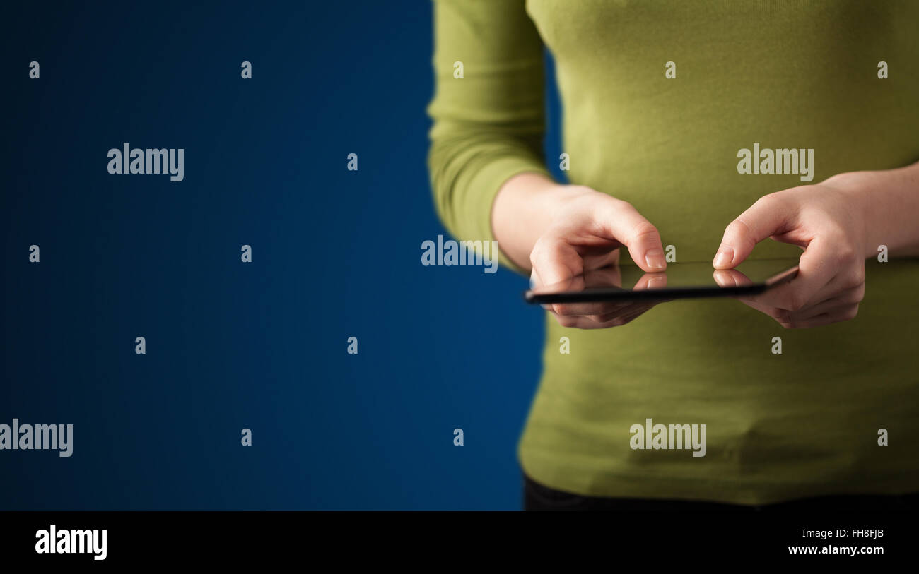 Close up of hand holding digital touchpad tablet device Stock Photo - Alamy