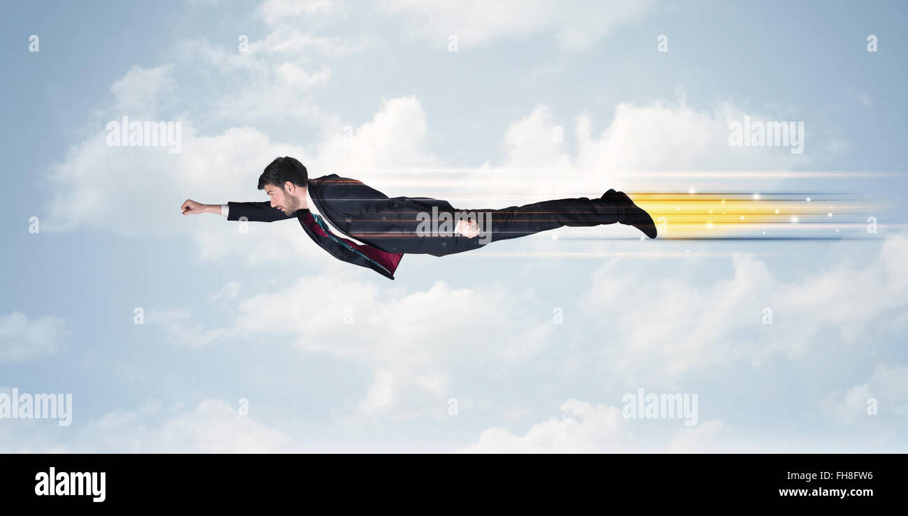 Happy business man flying fast on the sky between clouds Stock Photo ...