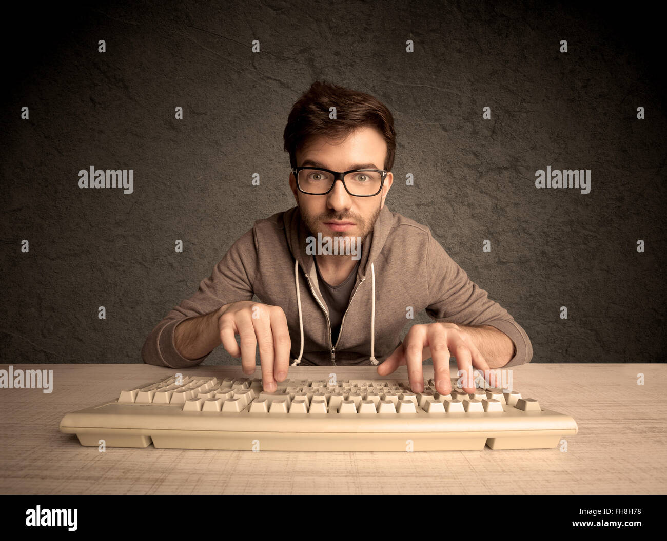 Computer geek typing on keyboard Stock Photo - Alamy
