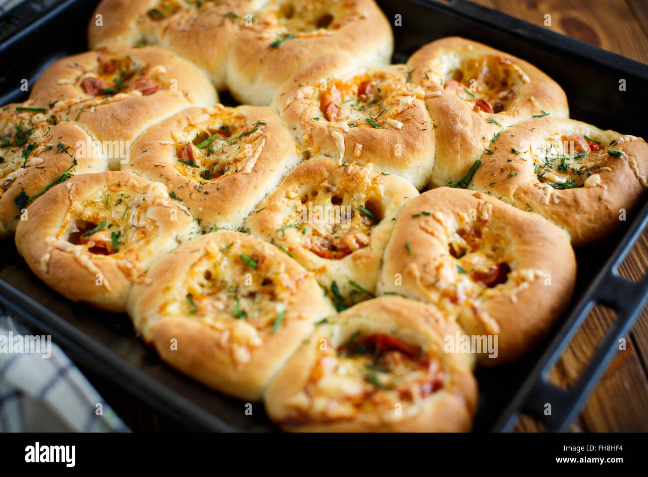 mini pizzas baked stuffed with cheese Stock Photo - Alamy
