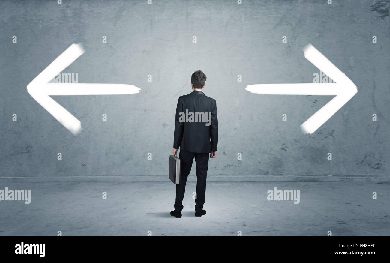 Confused business person choosing the way Stock Photo - Alamy