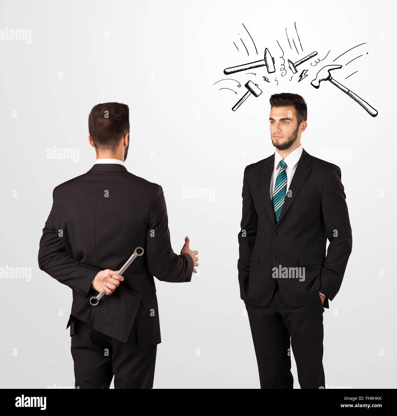 Businessman hiding a weapon Stock Photo - Alamy