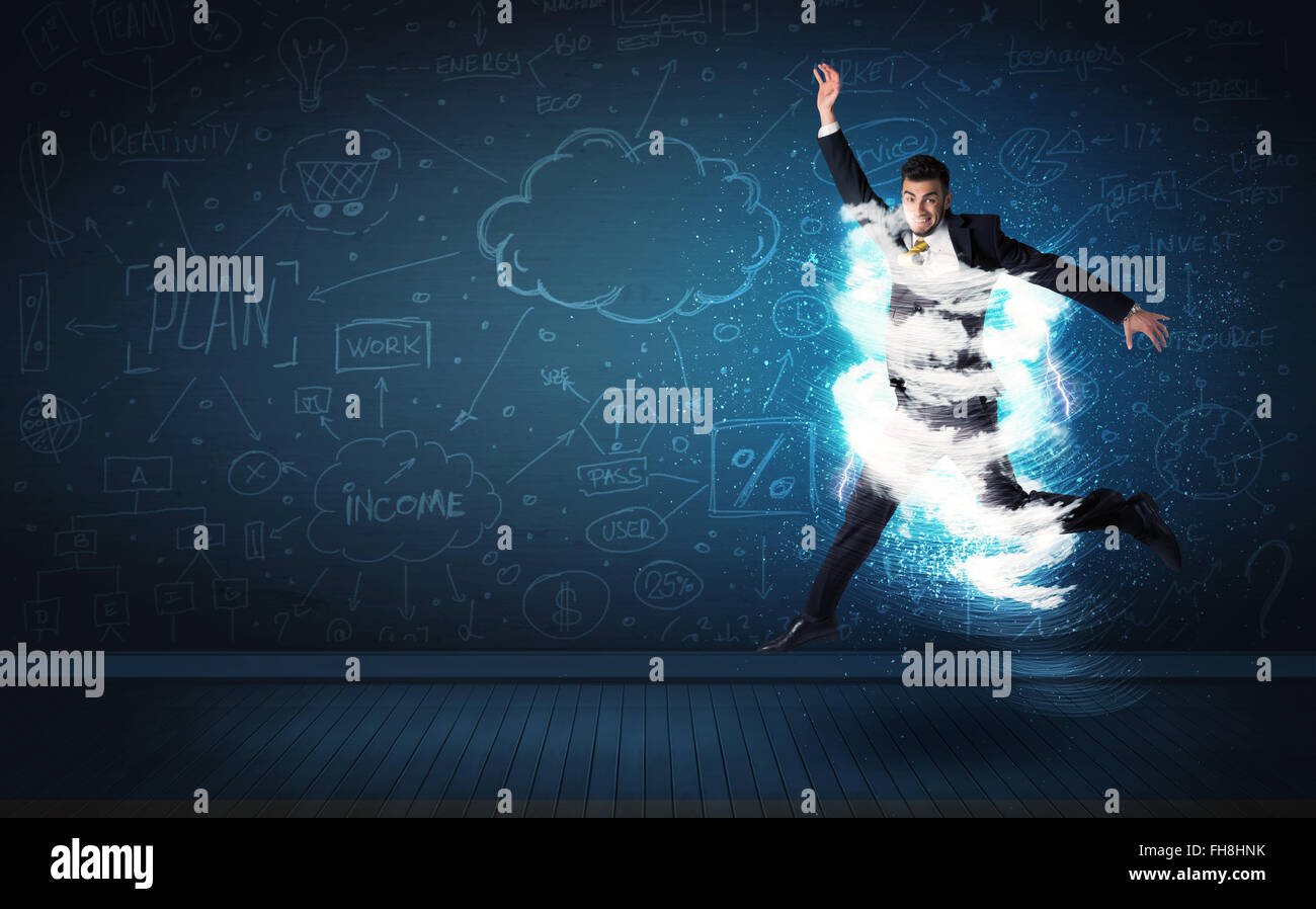Happy business man jumping with storm cloud around him Stock Photo - Alamy