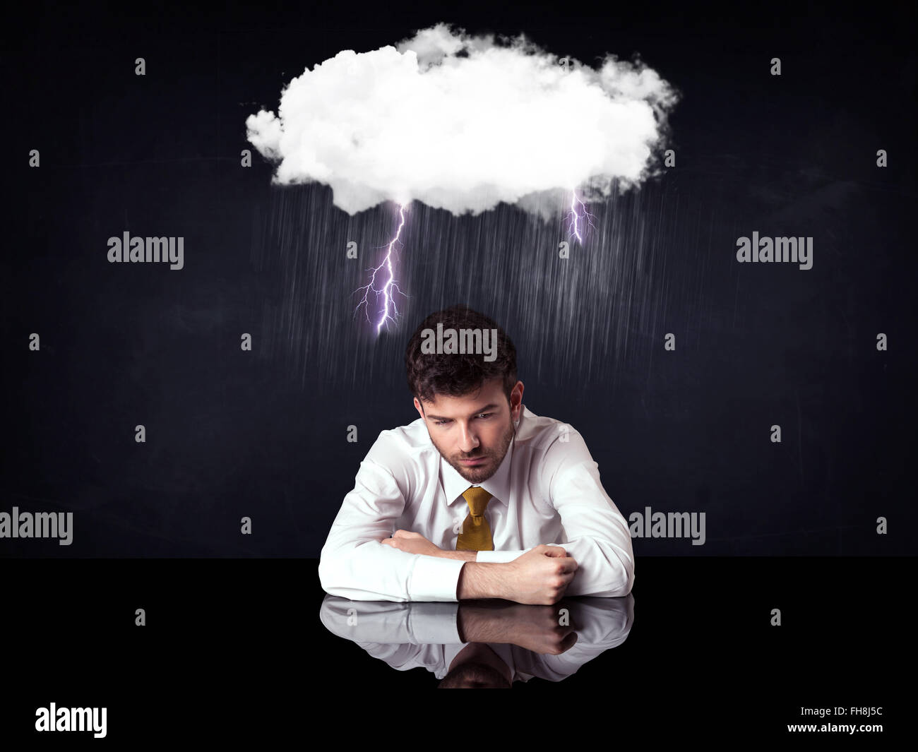 Sad man sitting under rain hi-res stock photography and images - Alamy