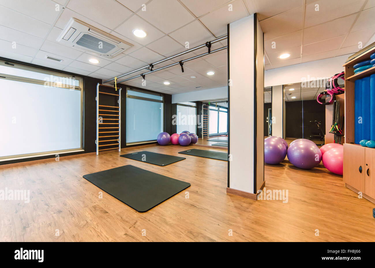 Training room in a pilates gym Stock Photo - Alamy