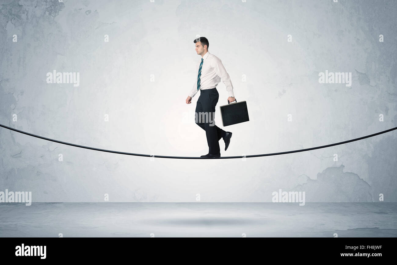 Businessman balancing on tightrope people hi-res stock photography and ...