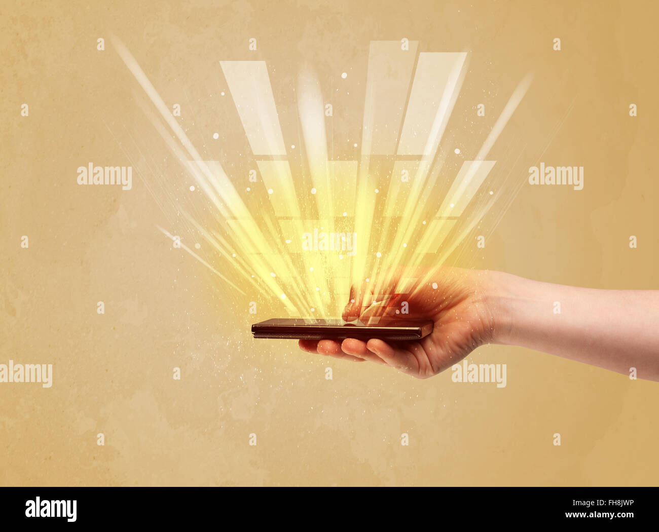 Hand with telephone and yellow light Stock Photo - Alamy