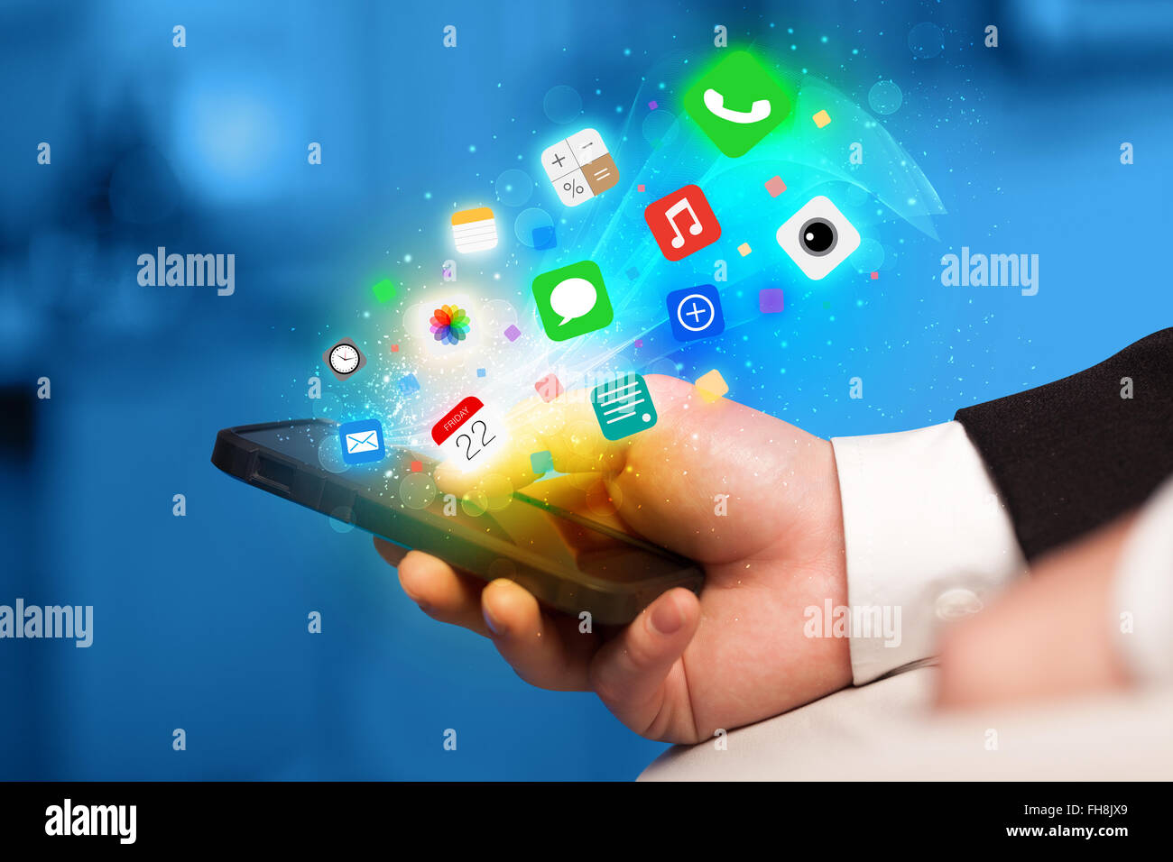 Hand holding smartphone with colorful app icons Stock Photo - Alamy
