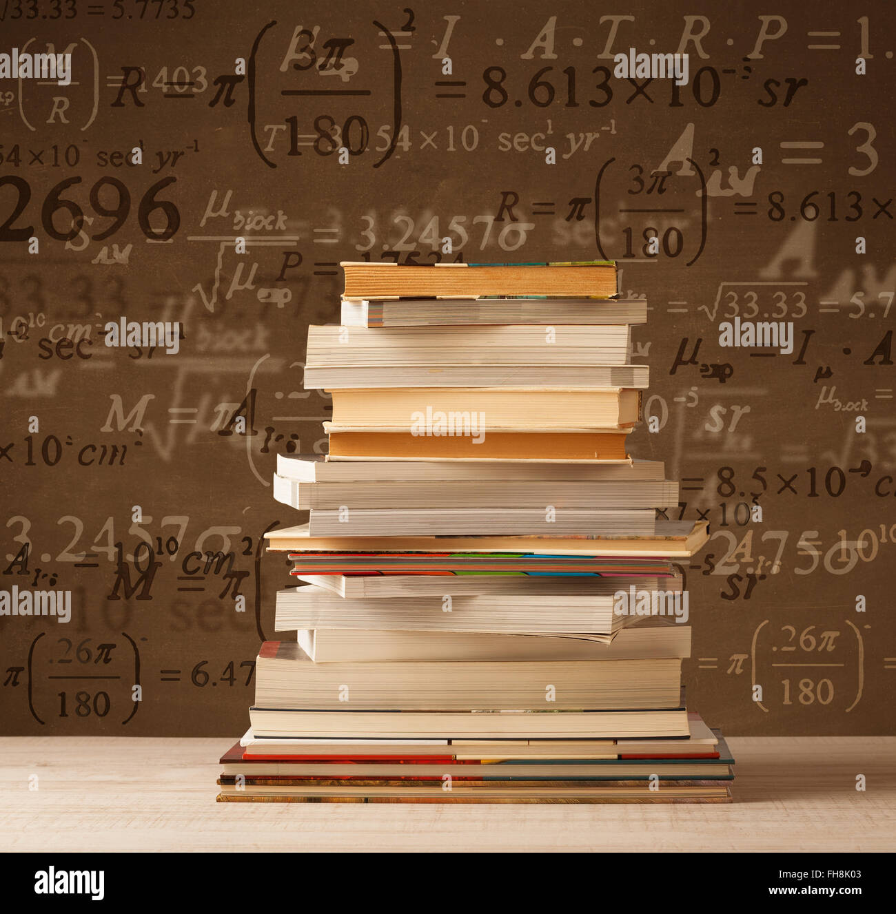 Books on vintage background with math formulas Stock Photo - Alamy