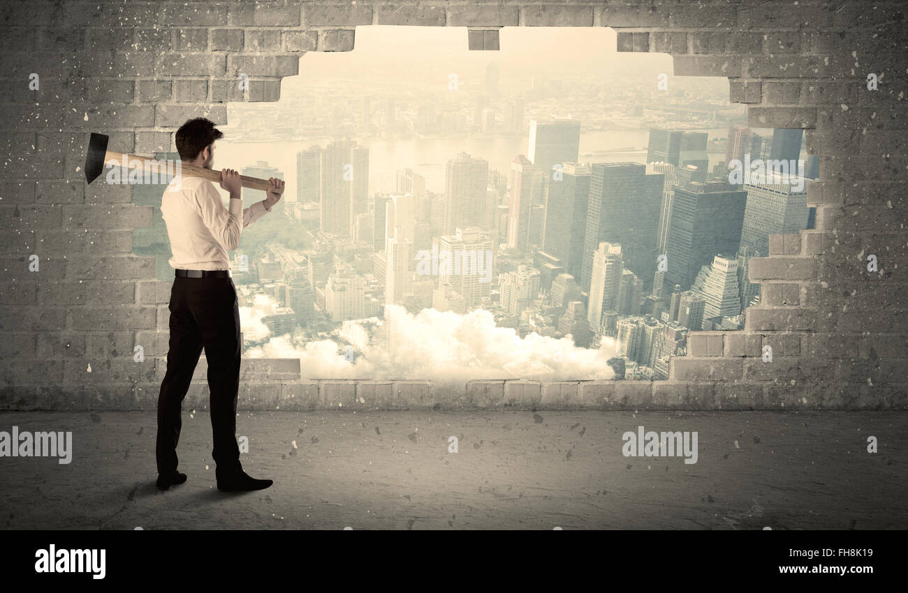 Business man hitting wall with hammer on city view Stock Photo - Alamy