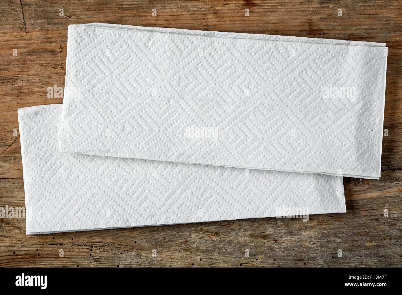 White paper napkin on wooden table, top view Stock Photo - Alamy