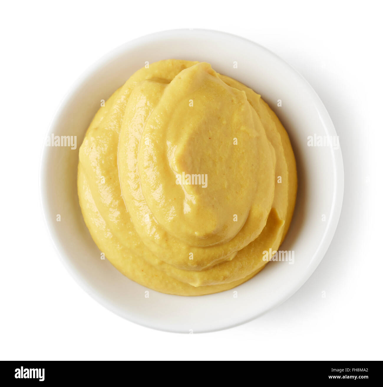 Mustard in round dish isolated on white background, top view Stock ...