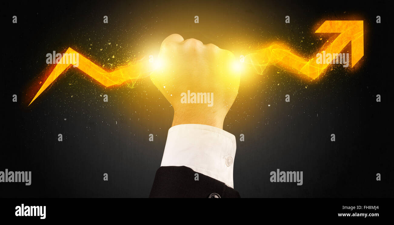 Business person holding a hot glowing upright arrow Stock Photo - Alamy