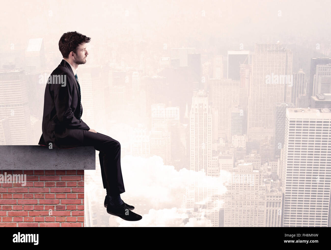 Office worker sitting on rooftop in city Stock Photo - Alamy