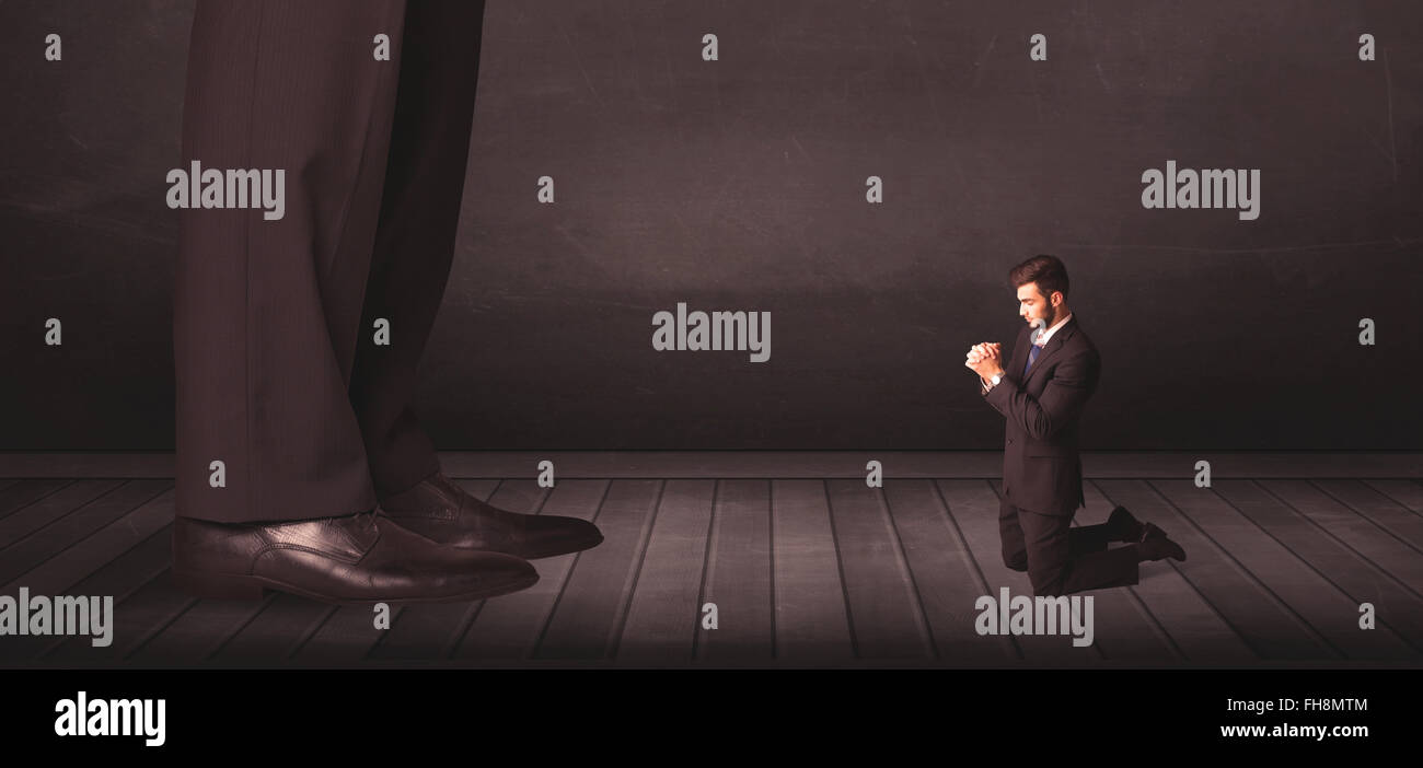 Big person with small businessman concept Stock Photo - Alamy