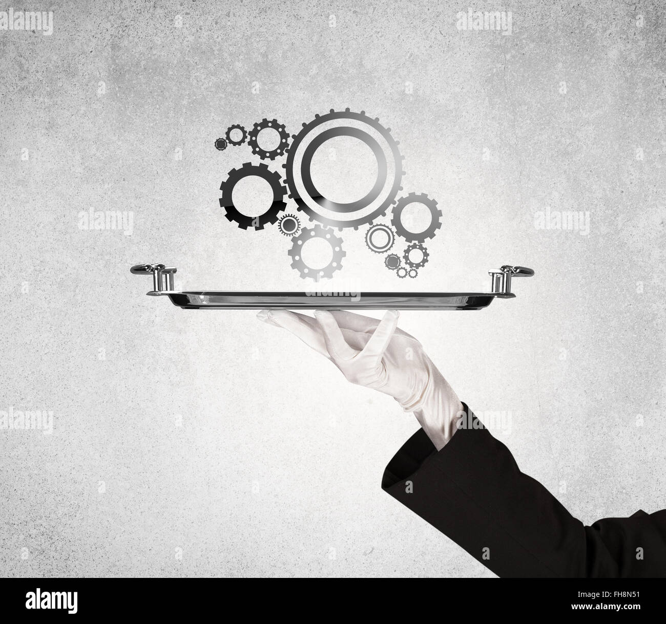 Working cog wheel concept on tray Stock Photo - Alamy
