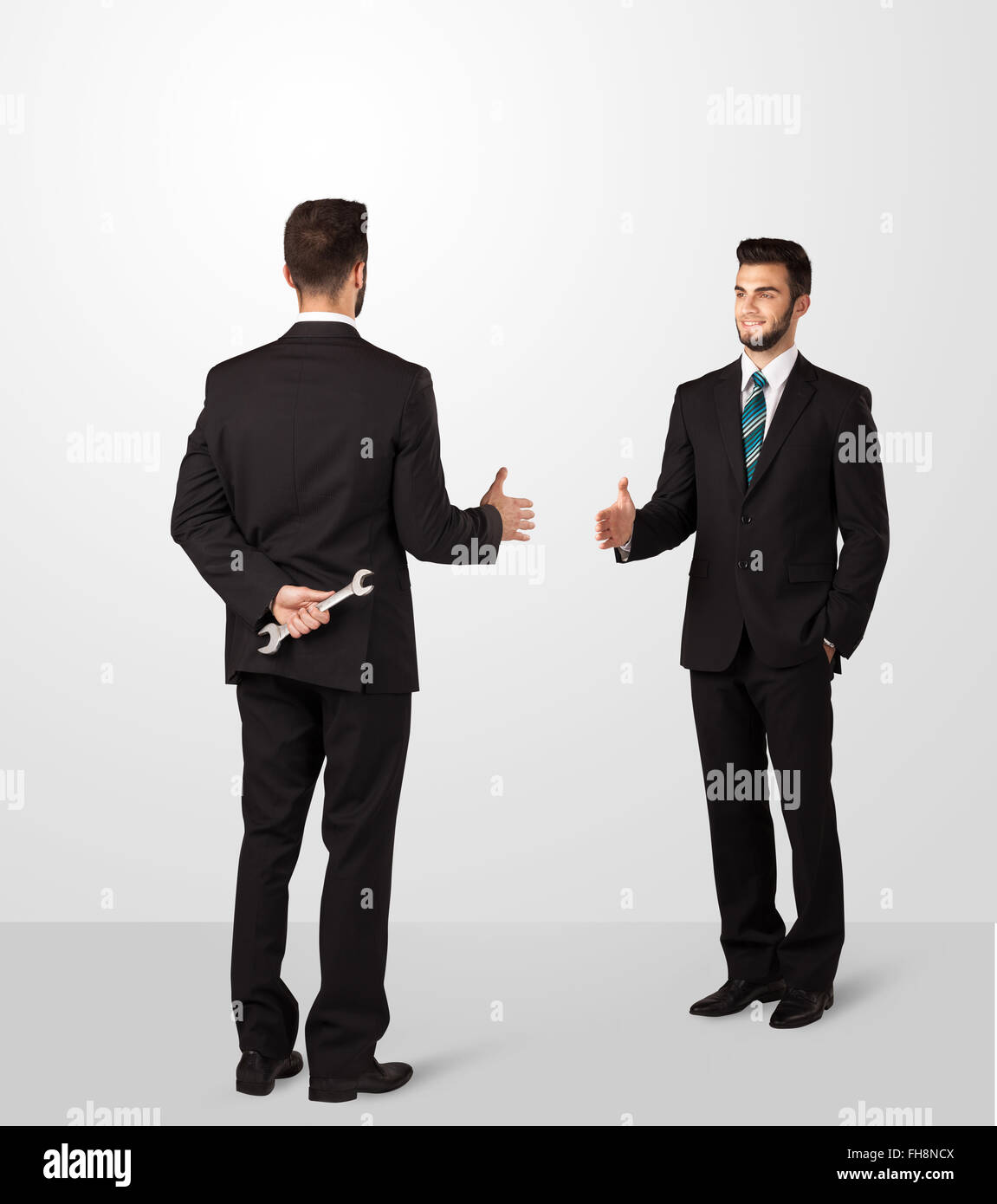 Two businessman shake hands Stock Photo - Alamy