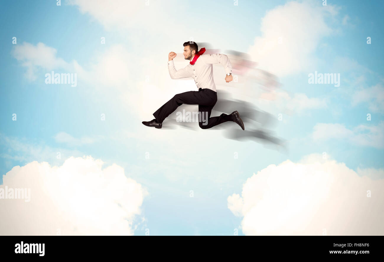 Business person jumping over clouds in the sky Stock Photo - Alamy