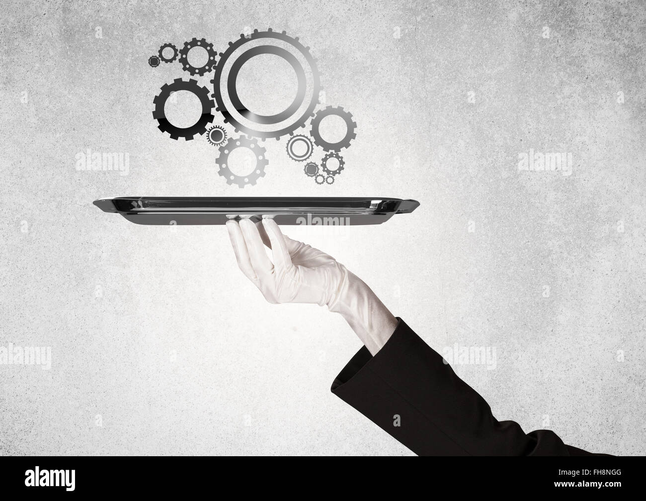 Working cog wheel concept on tray Stock Photo - Alamy