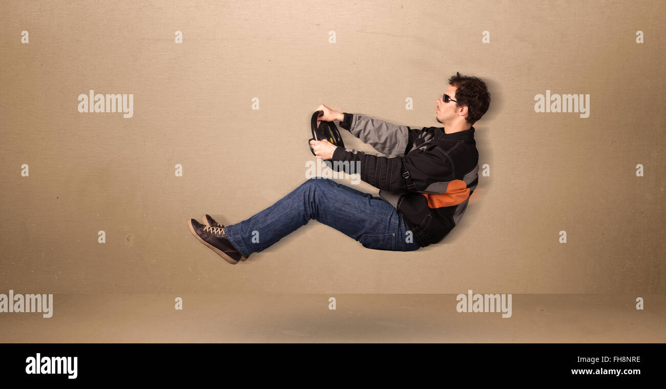 Happy funny man driving a flying car concept Stock Photo - Alamy