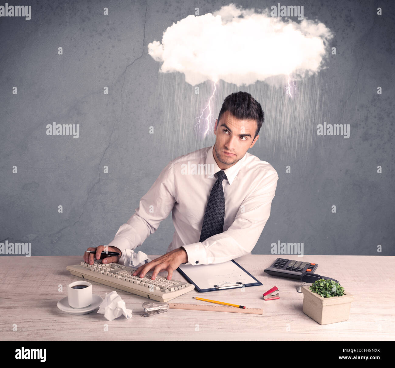 Stressed out businessman at office desk Stock Photo - Alamy
