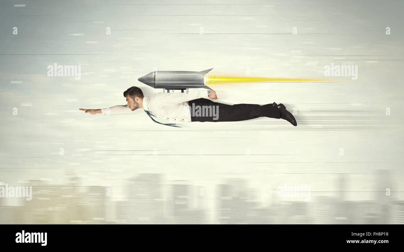 Superhero business man flying with jet pack rocket above the city Stock ...