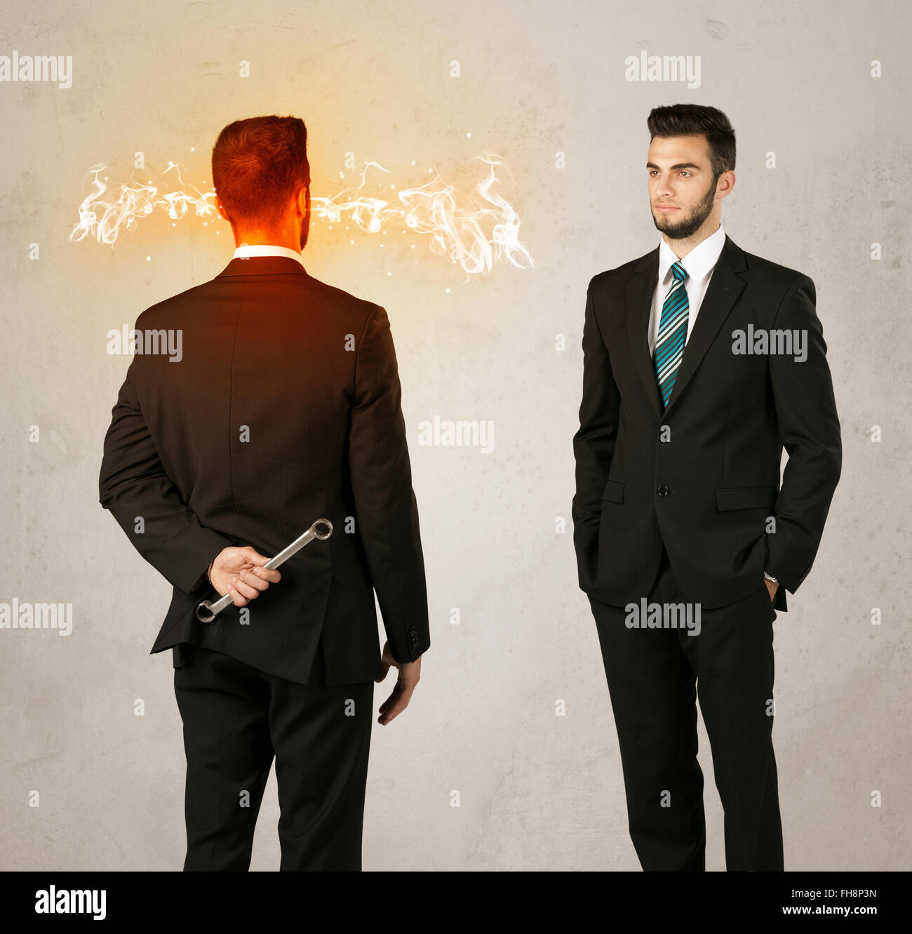 Angry businessman with weapon Stock Photo - Alamy