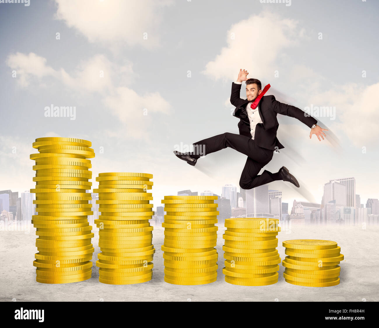 Successful business man jumping up on gold coin money Stock Photo - Alamy