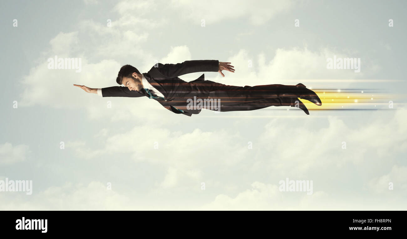 Happy business man flying fast on the sky between clouds Stock Photo ...