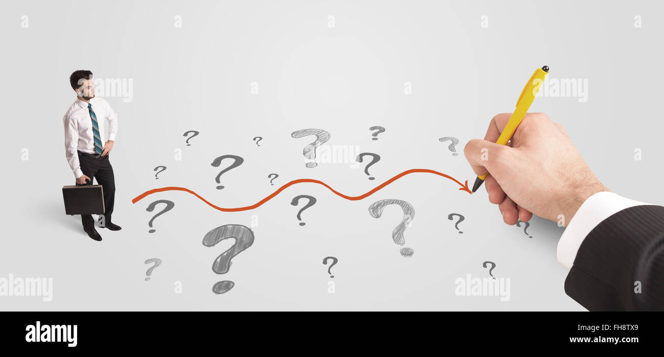 Business man looking at question marks and solution path Stock Photo ...