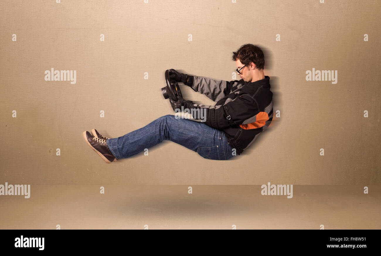 Happy funny man driving a flying car concept Stock Photo - Alamy