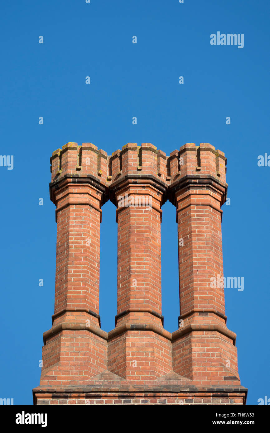 group of three tudor brick chimneys at hampton court palace, london ...
