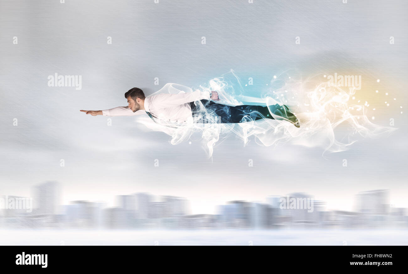 Hero superman flying above city with smoke left behind Stock Photo - Alamy