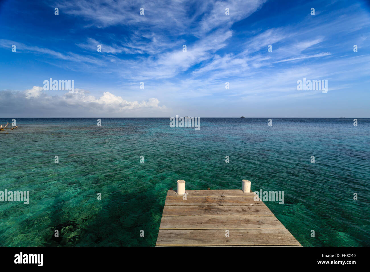 Dock looking over tropical blue and turquoise waters in Caribbean Stock ...