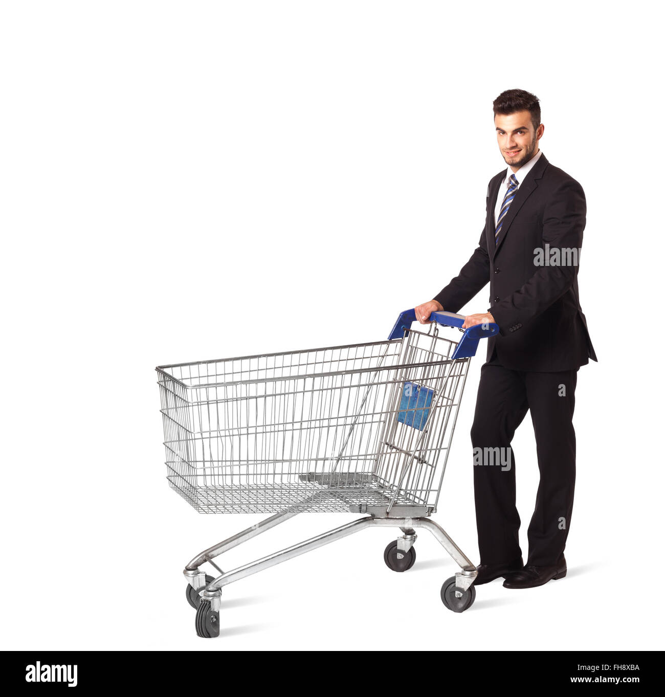 Businessman with shopping cart Stock Photo - Alamy