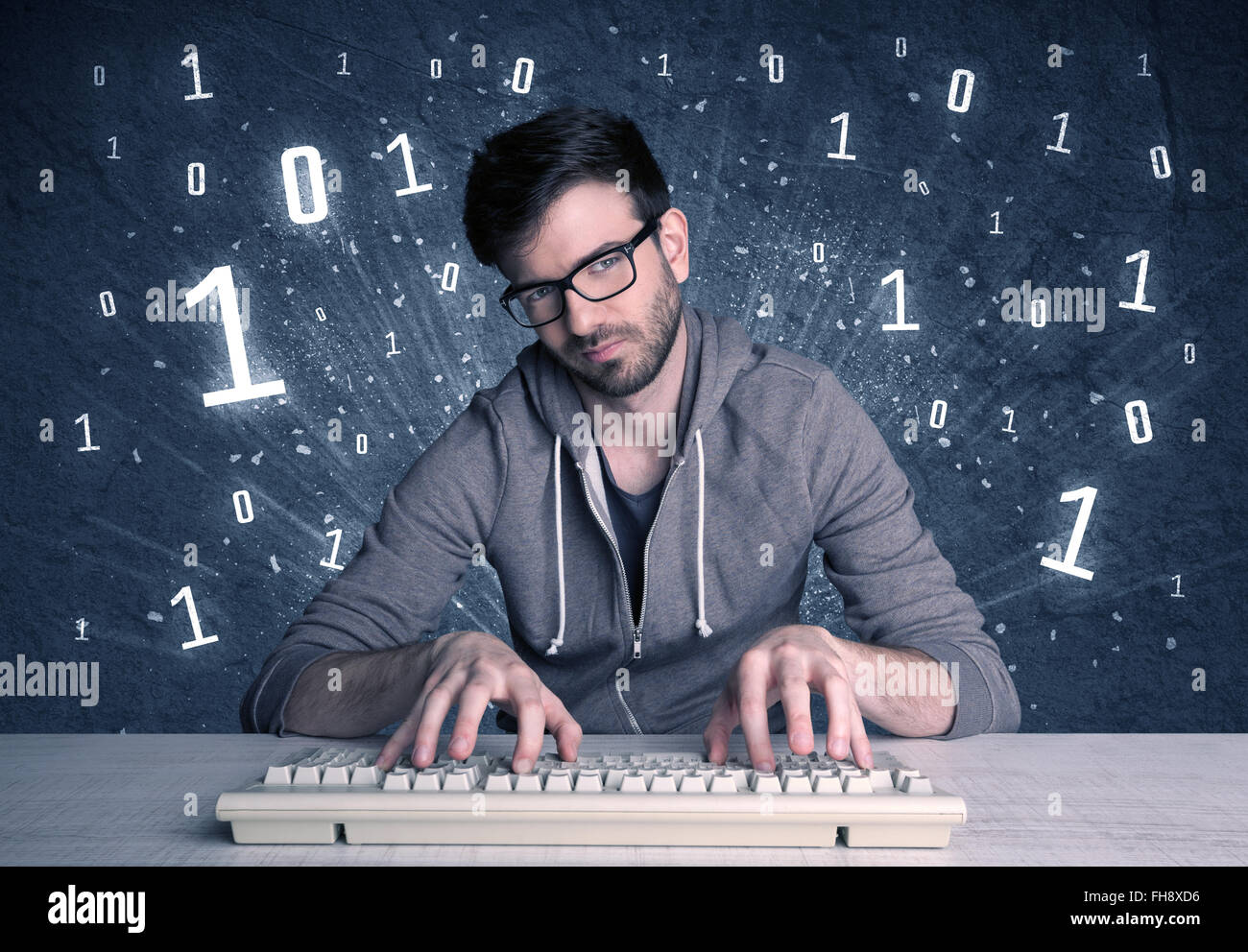 Online intruder geek guy hacking codes Stock Photo - Alamy