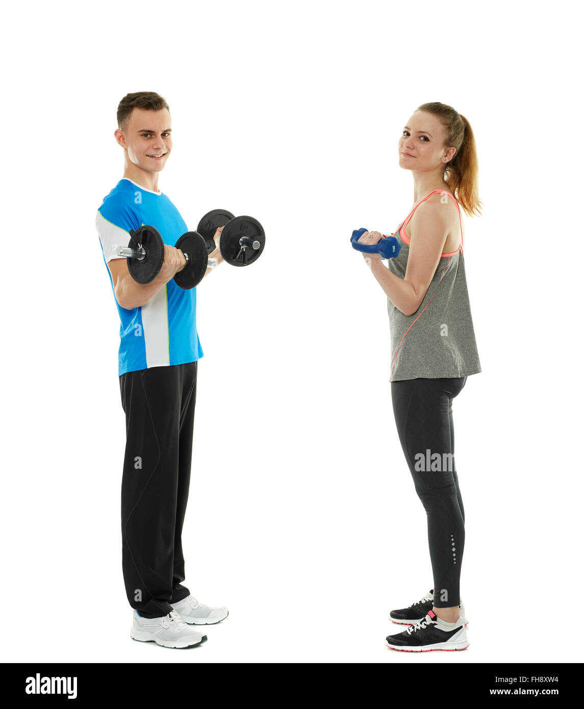 Teenagers boy and girl doing a fitness workout with dumbbells Stock ...