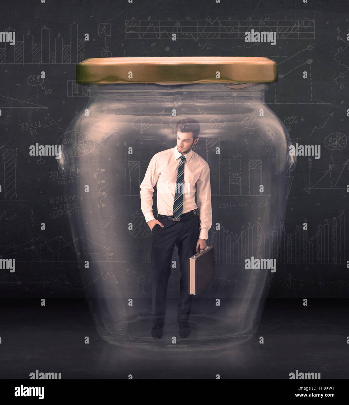 Business man closed into a glass jar concept Stock Photo - Alamy