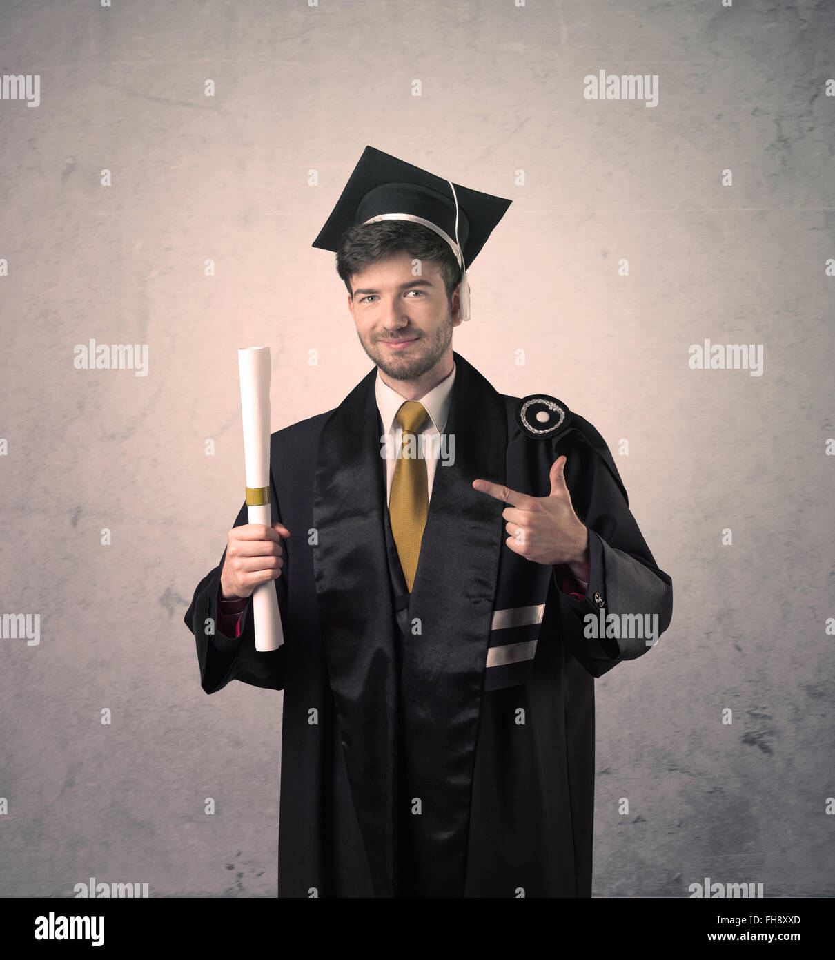 Portrait of a young graduate student on grungy background Stock Photo ...