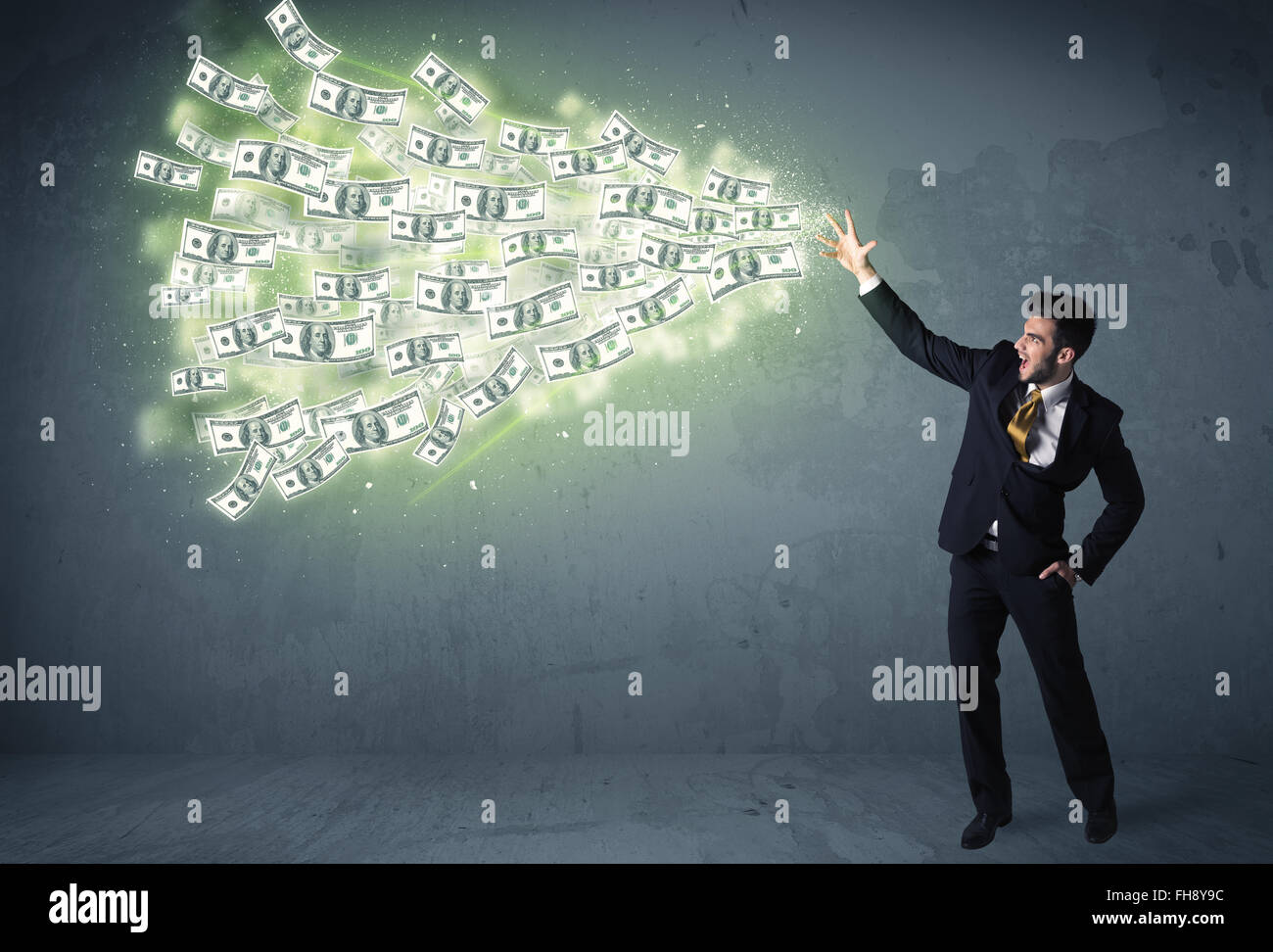 Handsome man throwing dollar hi-res stock photography and images - Alamy