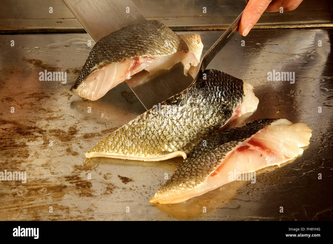Preparing fish for a restaurant Stock Photo - Alamy