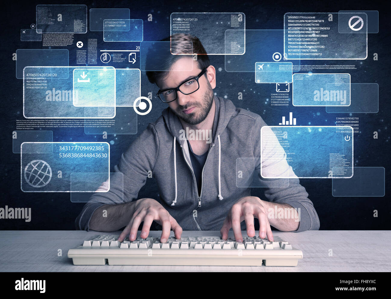 Nerd with glasses hacking websites Stock Photo - Alamy