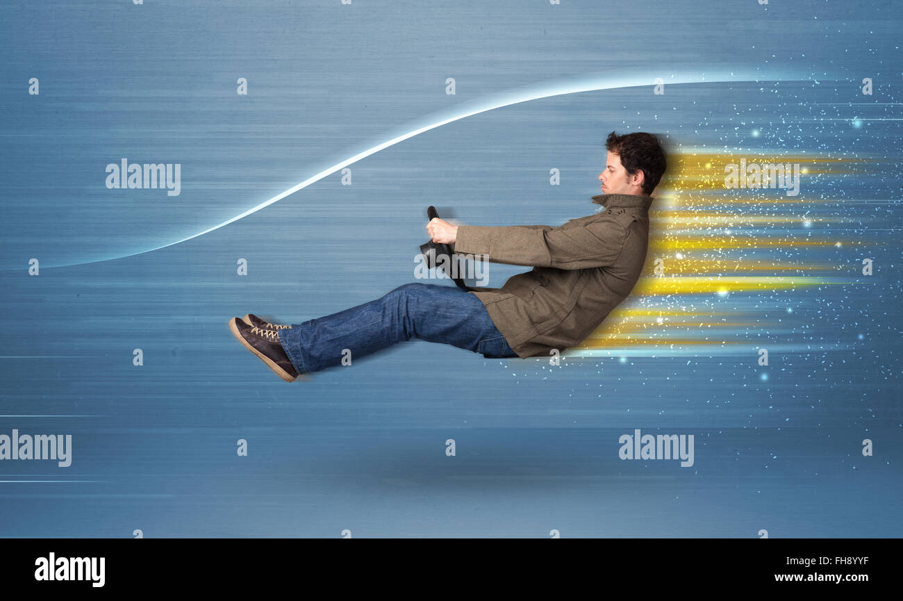 Young man driving in imaginary fast car with blurred lines Stock Photo ...