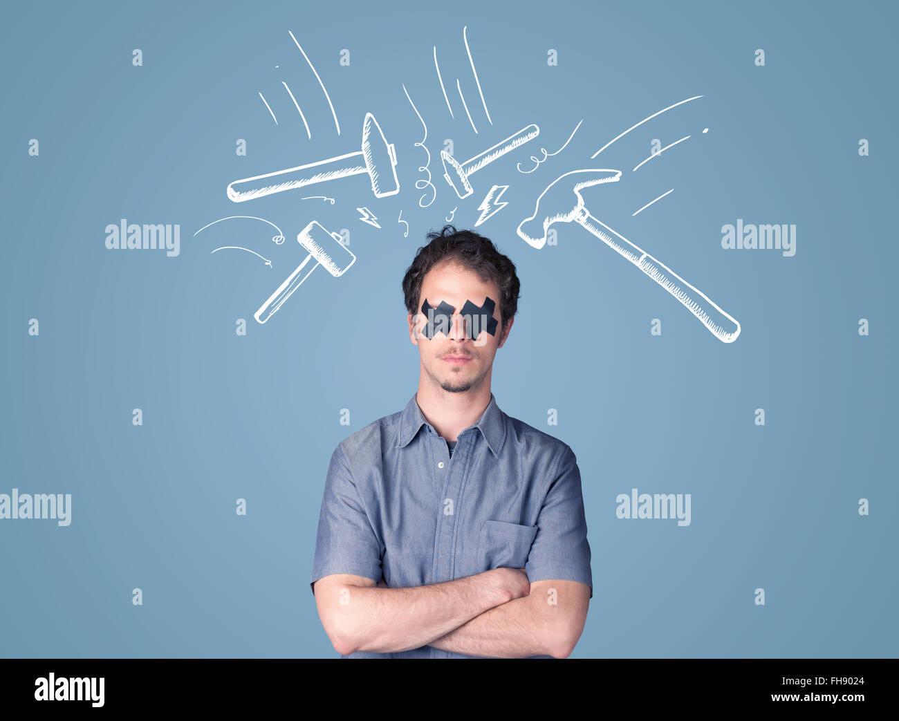Young man with glued eye and hammer marks Stock Photo - Alamy