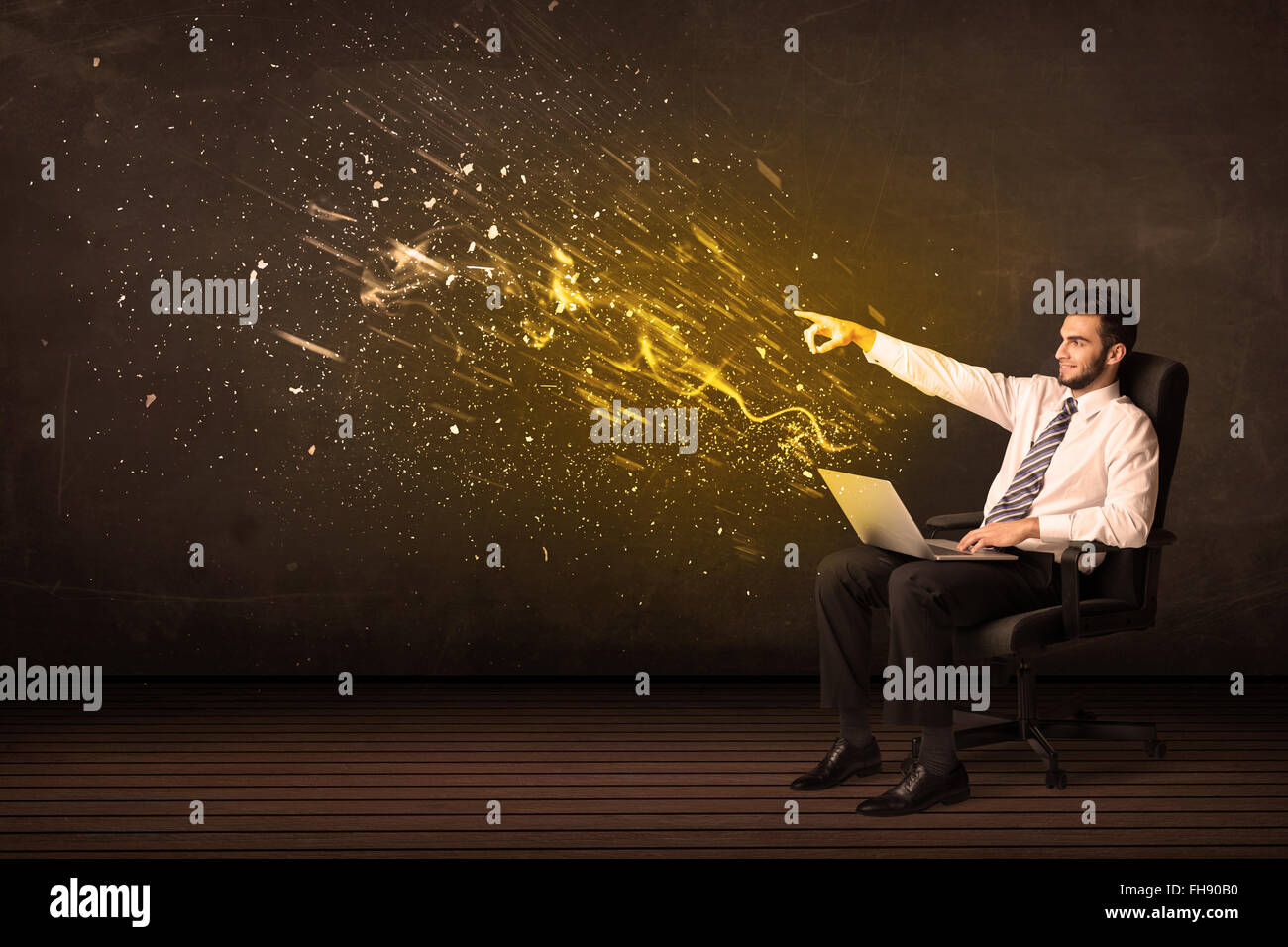 Businessman with laptop and energy explosion on background Stock Photo ...