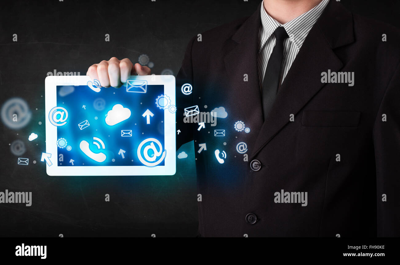 Person holding a tablet with blue technology icons and symbols Stock ...