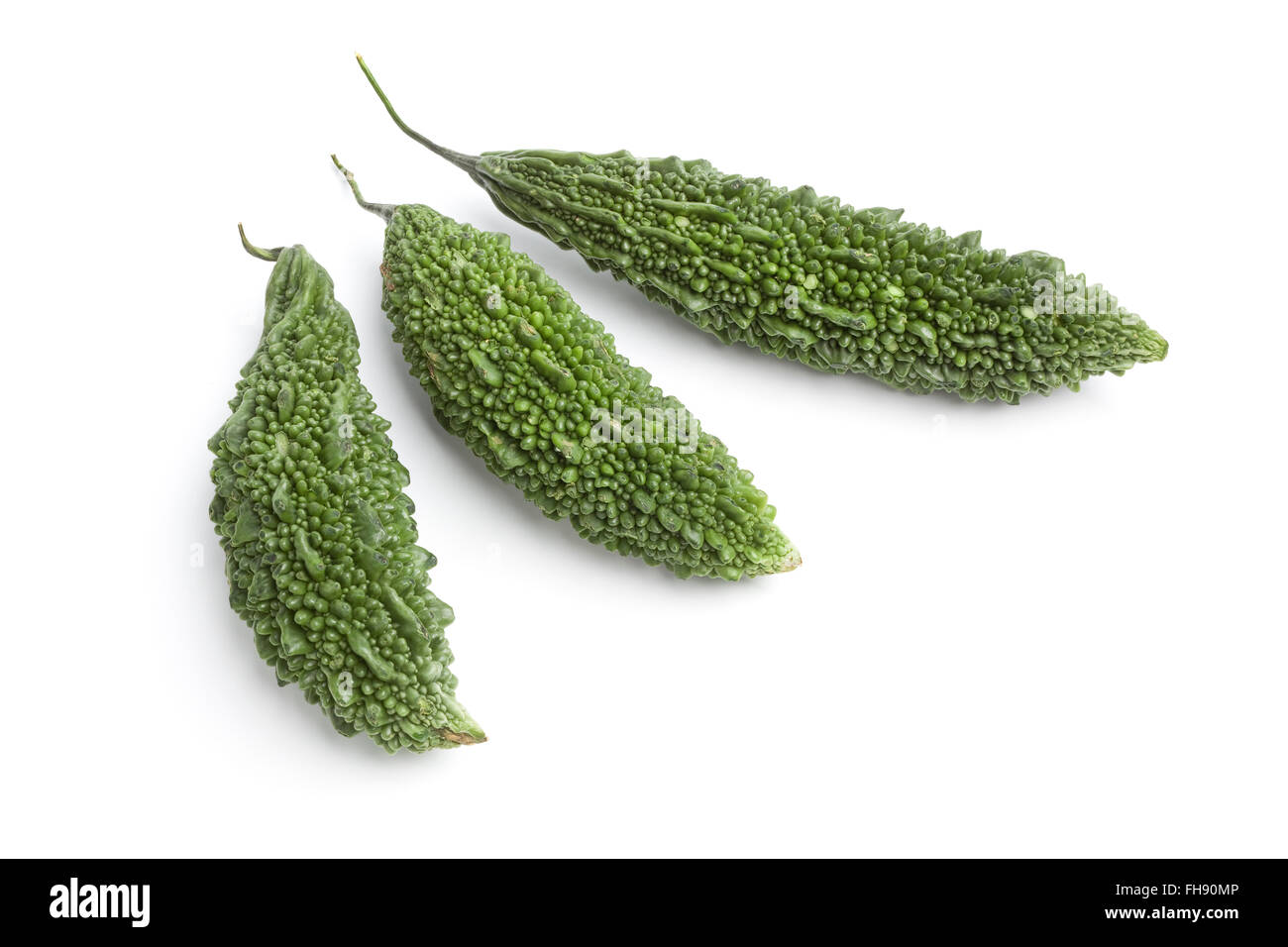 Whole fresh raw bitter melon gourds on white background Stock Photo - Alamy