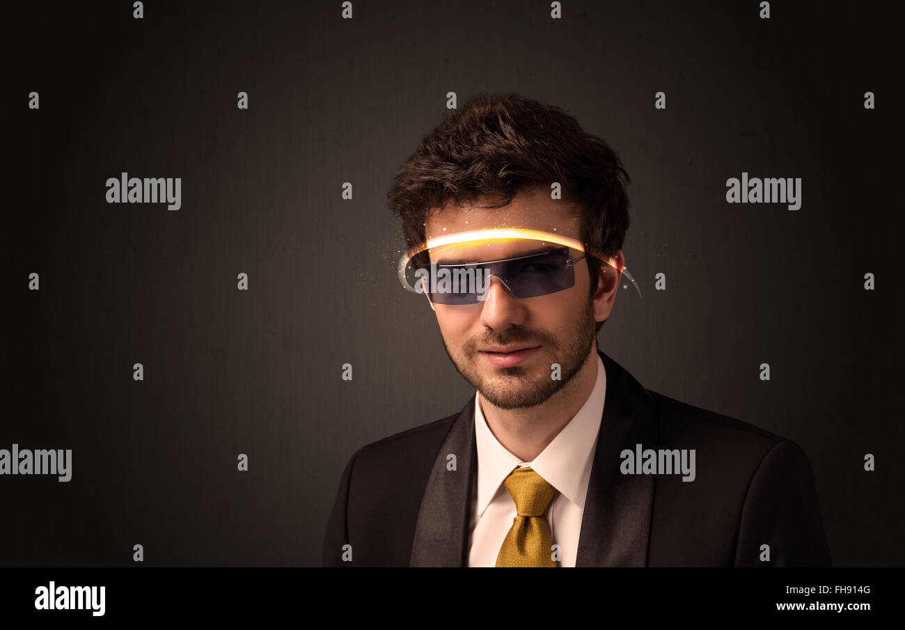 Handsome man looking with futuristic high tech glasses Stock Photo - Alamy