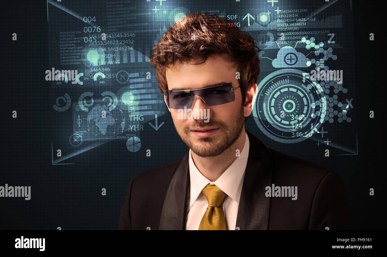 Young man looking with futuristic smart high tech glasses Stock Photo ...
